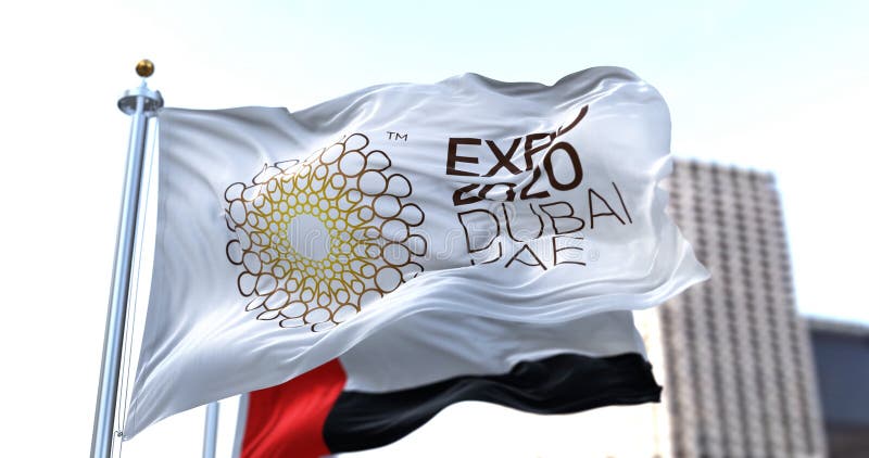The Flag of Expo 2020 Waving in the Wind with the UAE Flag Blurred in ...