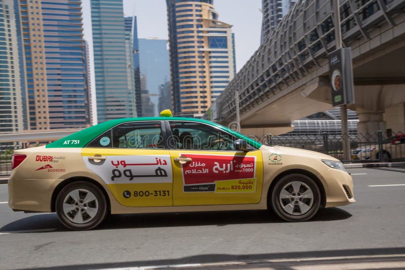 DUBAI, UAE - MAY 12, 2016: Taxi on Sheikh Zayed Road Editorial Image ...