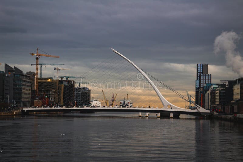 Dublin Bridge Over River with Construction and Tall Buildings Editorial ...