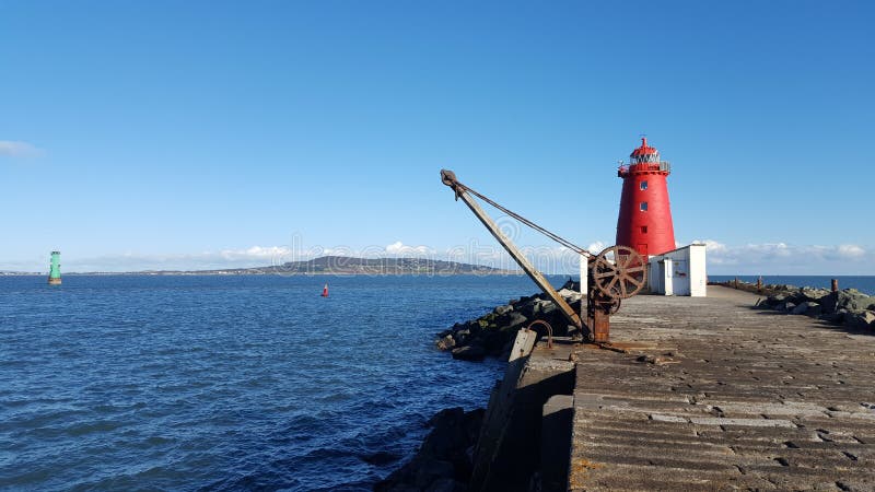 Dublin pier and lighthouse stock image. Image of water - 91165235