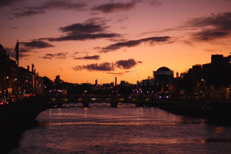 Dublin`s Cityscape during a Colorful Sunset with Clouds and Seagulls ...
