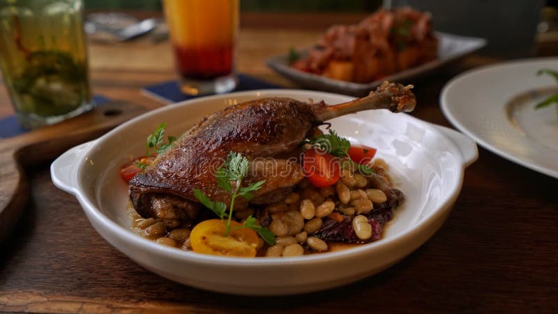 Duck Confit on Fried Beans stock image. Image of cooking - 230212855