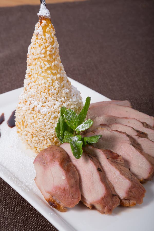 Duck meat with pear stock image. Image of poultry, grilled - 74089997