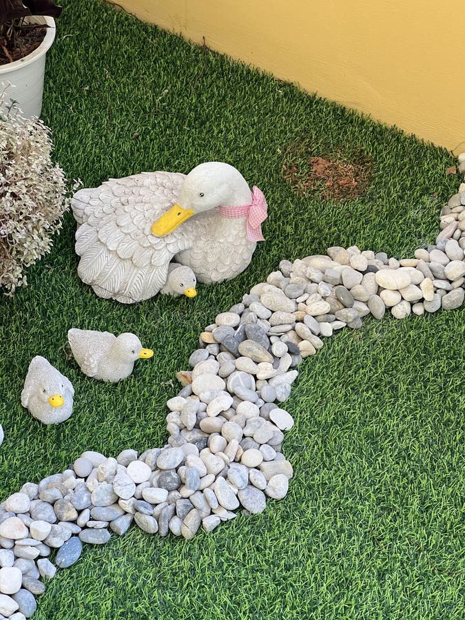 Duck Statue with Stone on Grass Stock Photo - Image of play, texture ...