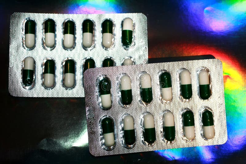 Compresse Multicolori E Capsule Accatastate Con Uno Scorrevole Immagine ...