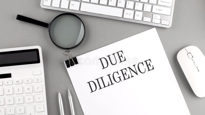 DUE DILIGENCE Written on Paper with Office Tools and Keyboard on the ...