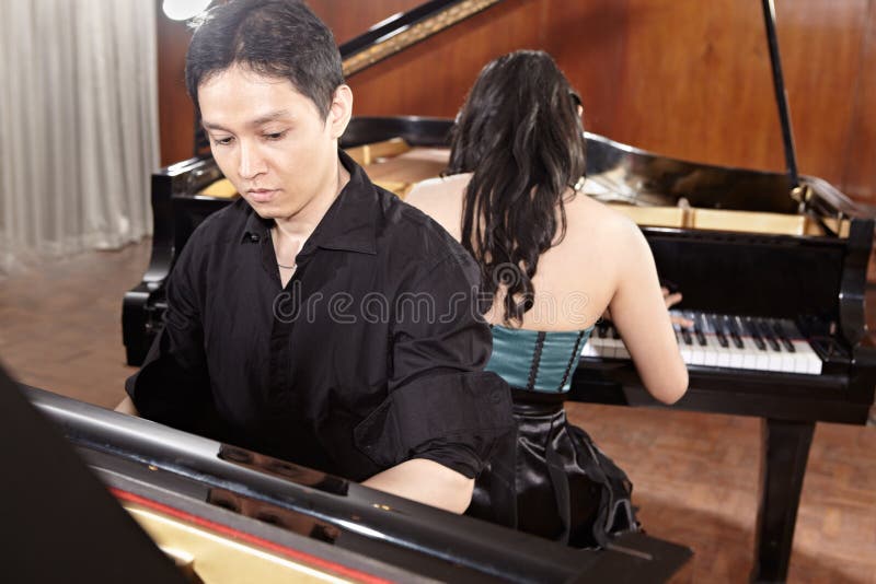 Piano duet stock image. Image of artist, male, female - 30626079