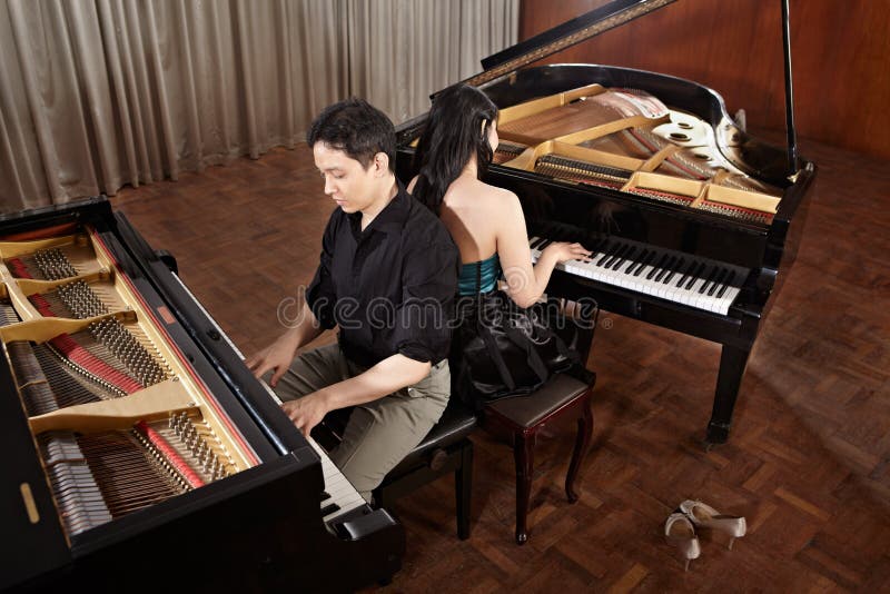 Piano duet stock image. Image of artist, male, female - 30626079