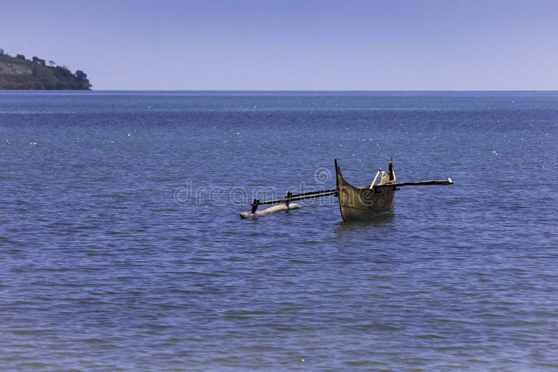 A Dugout Canoe Drifting in the Shallow Water Off an Island Stock Photo ...