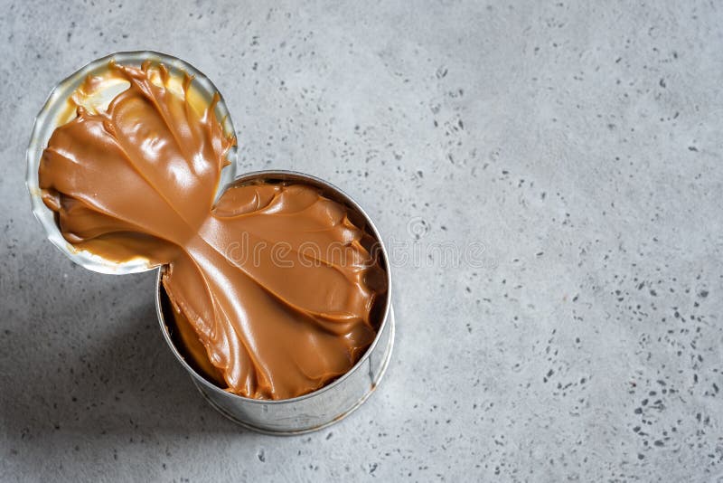 Dulce de leche in a can stock photo. Image of caramel - 139084156