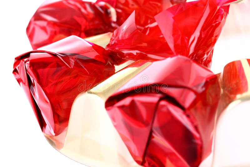 Dulces De Lujo Rojos En Una Fila Aislada En Blanco Imagen de archivo ...