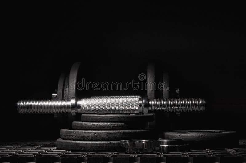 Dumbbell for Strength Training on a Dark Background. Stock Image ...