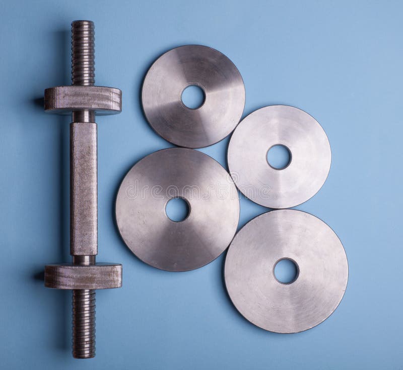 Dumbbell with Weights Isolated on Blue Background Stock Image - Image ...