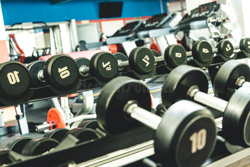 Dumbbells in the Interior of the Gym without People Stock Image - Image ...