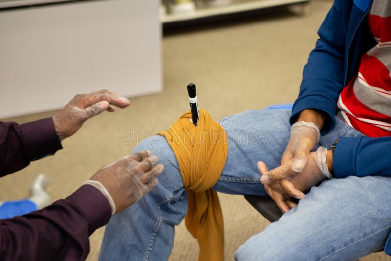 First Aid Training To Treat a Stab Wound by Fixing the Object. Stock ...