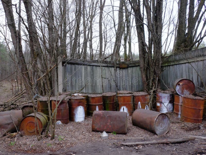 Dump of Rusty Metal Barrels. Industrial Waste Dump Stock Photo - Image ...