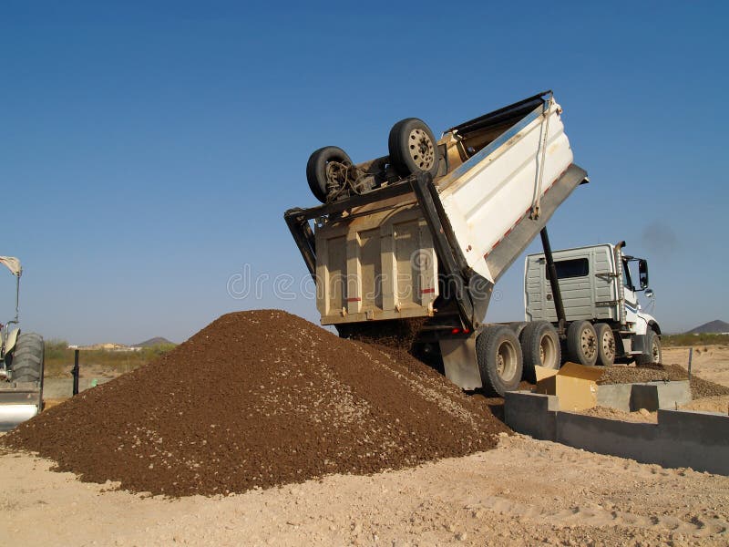 Dump Truck Backed Up Dumping Dirt Stock Photo - Image of foundation ... Dump Truck Backed Up Dumping Dirt Stock Photo - Image of foundation ...
