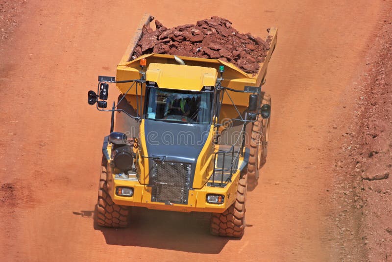 Dump Truck Tipping on a Road Construction Site Stock Photo - Image of ...