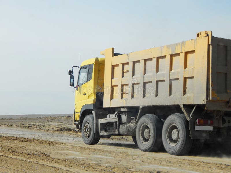 Dump truck on a dirt road. stock image. Image of sand - 92475623