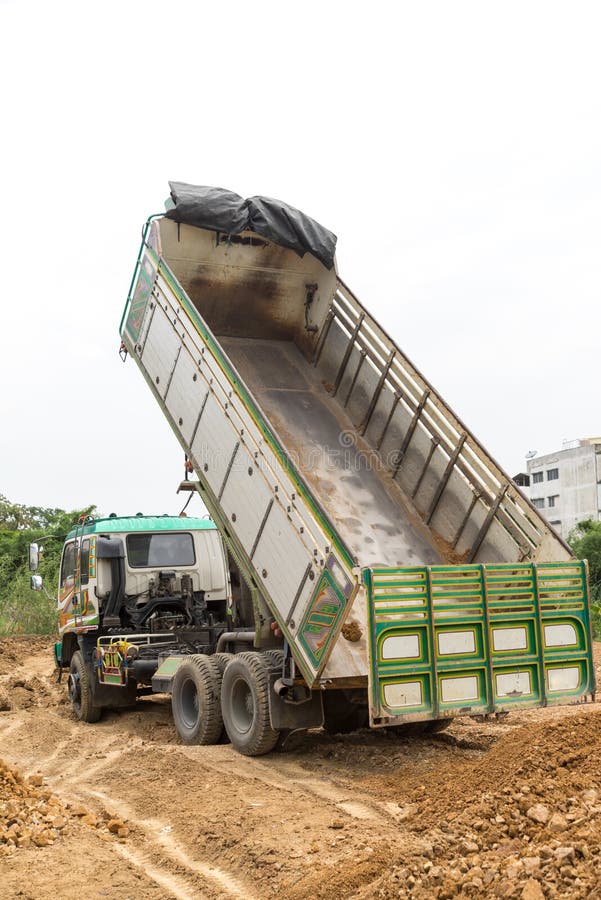 Dump Truck Dumps Its Load of Rock and Soil on Land Stock Image - Image ...