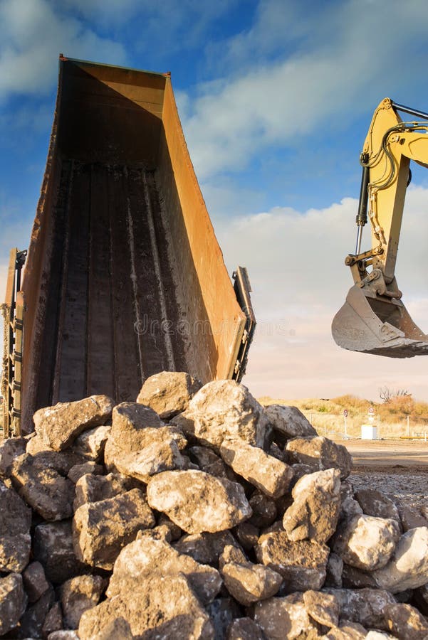 Dump Truck Unloading Its Cargo on a Construction Site Stock Image ...