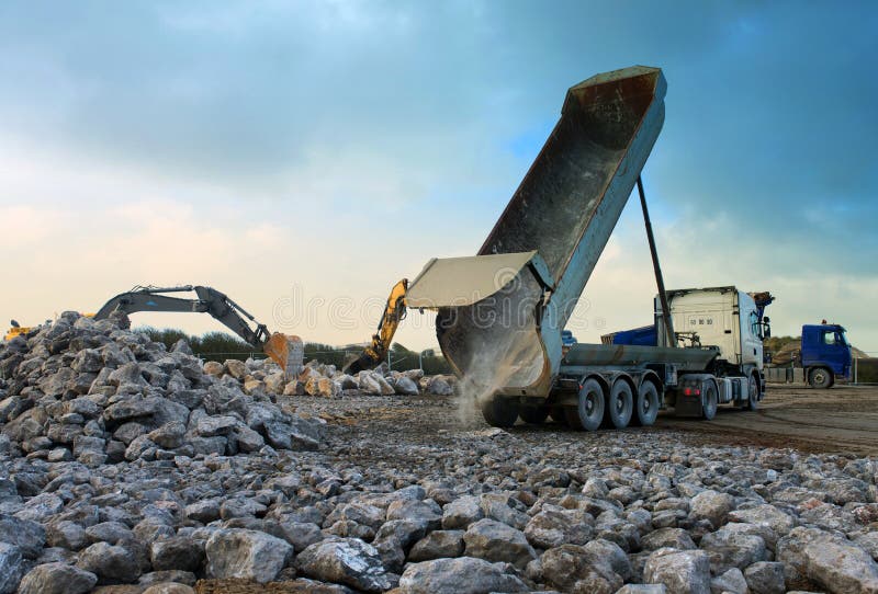 Dump Truck Unloading Its Cargo on a Construction Site Editorial ...