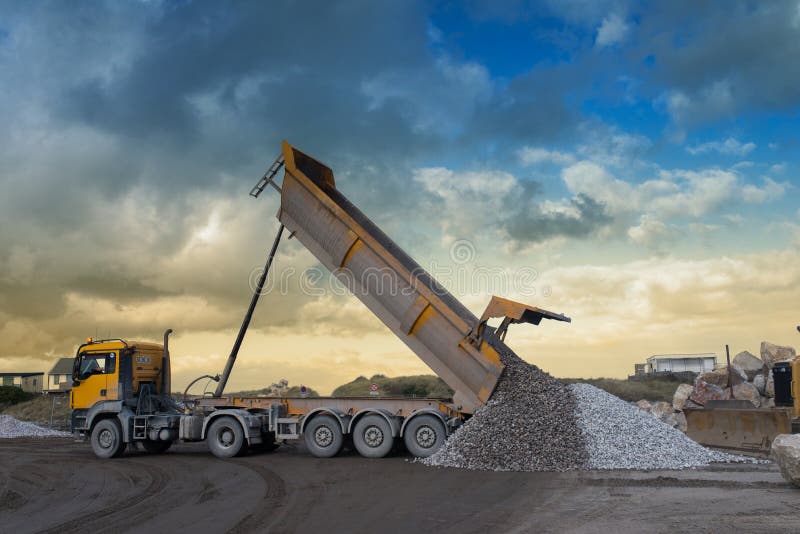 Dump Truck Unloading Large Rocks To Reinforce a Stock Image - Image of ...