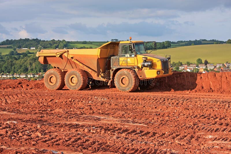 Dump Truck Tipping on a Road Construction Site Stock Image - Image of ...