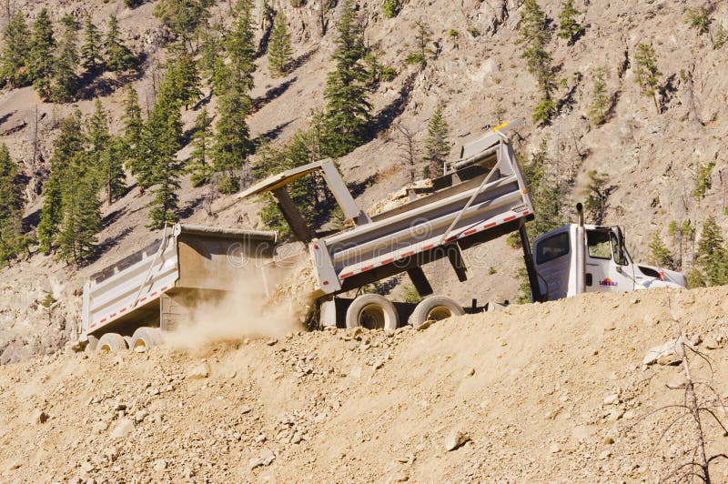 Dump Truck and Trailer Unloading Dirt Editorial Photo - Image of diesel ...