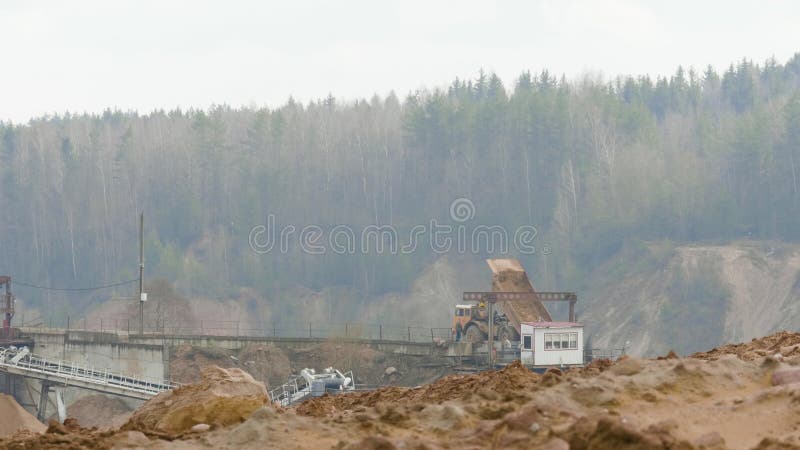 Dump Truck Unload Sand on the Assembly Line on Ballast Quarry Stock ...