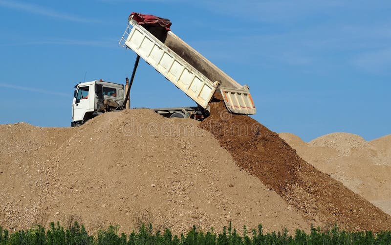 Dump Truck Unloading Soil stock photo. Image of scale - 62955172