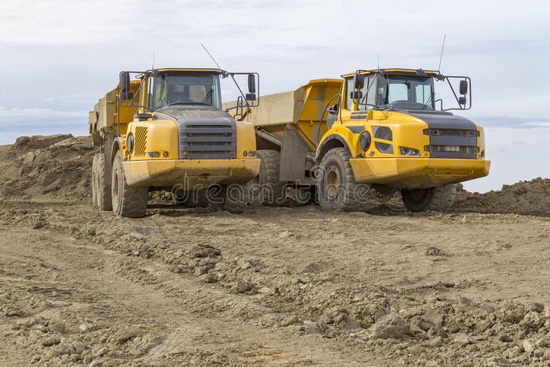 Dump Trucks at a Construction Site Stock Image - Image of traction ...