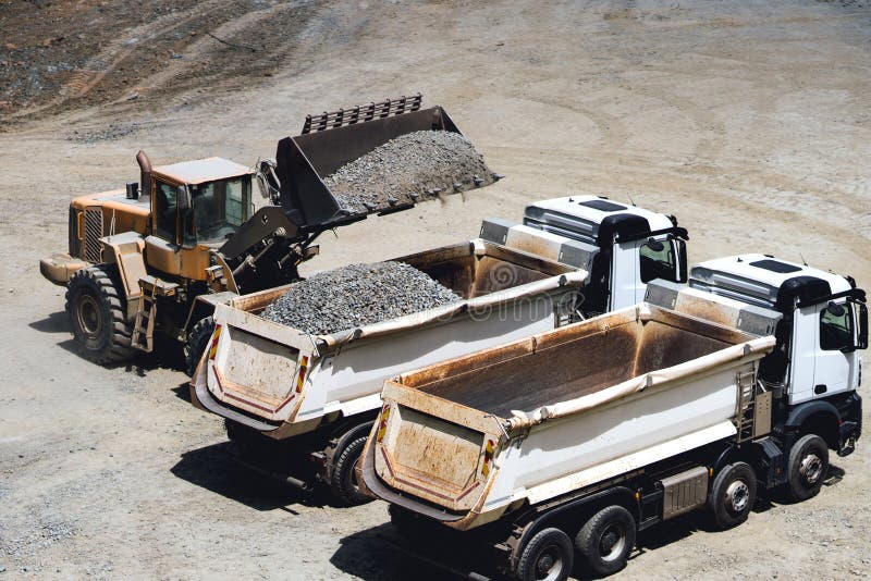 Dumper Trucks Being Loaded on Ore Mine, Works at Open Pit Mine Stock ...