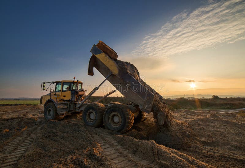 Dumper Unloading Its Cargo on a Construction Site Stock Image - Image ...