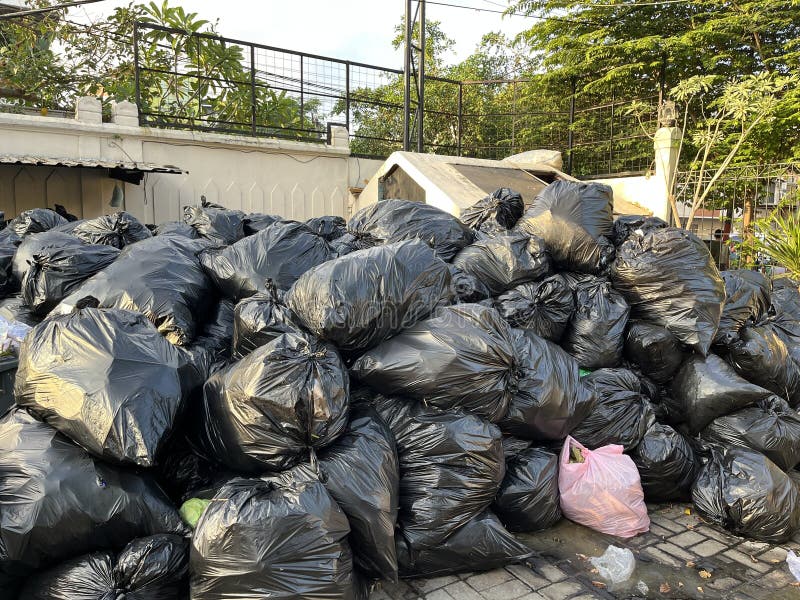 Dumping Ground with Pile of Black Garbage Bags Stock Image - Image of ...