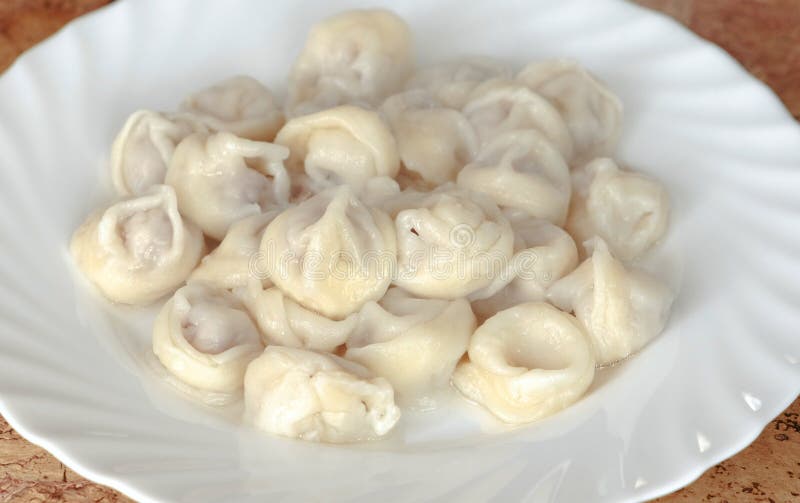 Dumplings on a Plate on Wooden Table. Stock Image - Image of tasty ...
