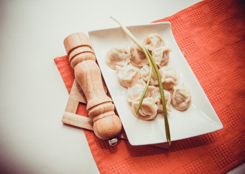 Dumplings on square plate stock photo. Image of dish - 64198388