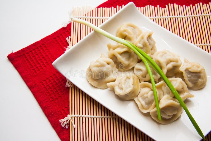 Dumplings on square plate stock image. Image of dumplings - 65158617