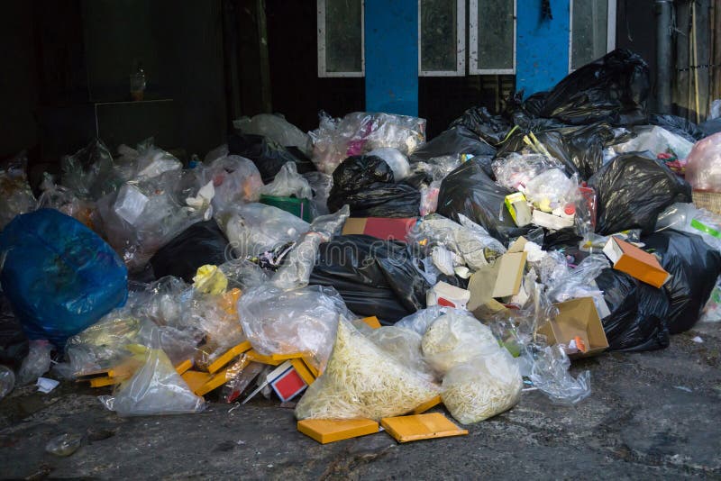 Dumpsters Being Full with Garbage in a City. Stock Photo - Image of ...