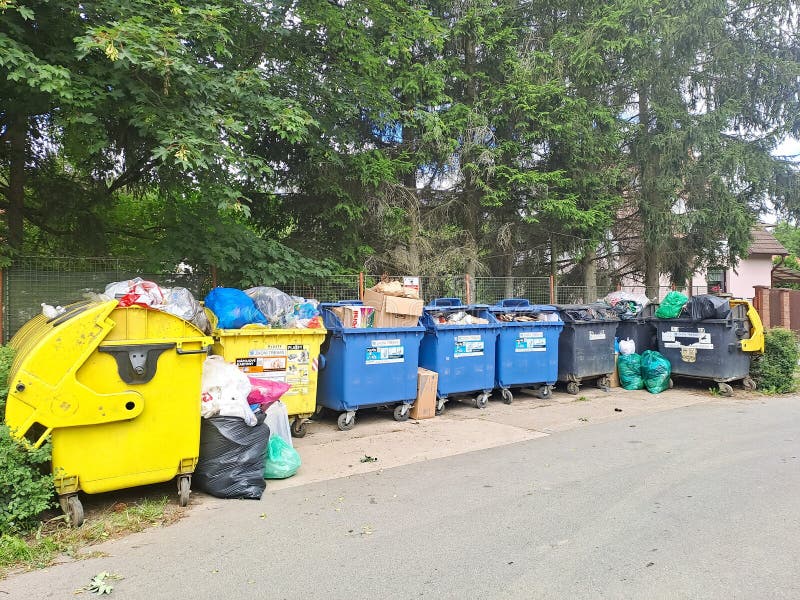 Dumpsters Being Full with Garbage. Trash Can Overflowing Litter ... Dumpsters Being Full with Garbage. Trash Can Overflowing Litter ...