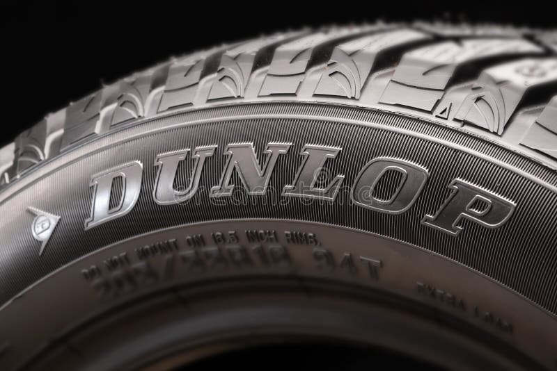 Dunlop Logo is Large on a Black Background, on the Side of the New Tire ...
