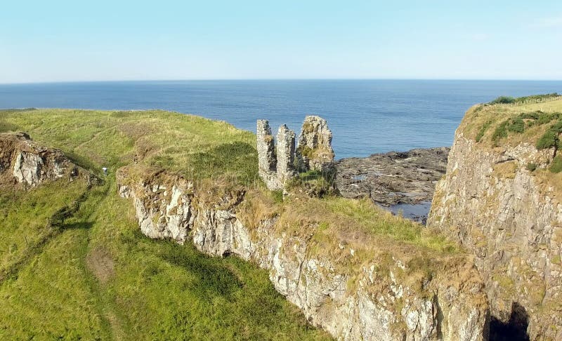 Ruins Of Dunseverick Castle Atop Green Cliffs Of The Causeway Coast ...