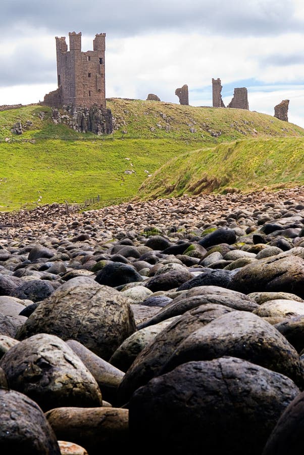 Dunstanburgh Castle and Rocks I Stock Photo - Image of coast ...