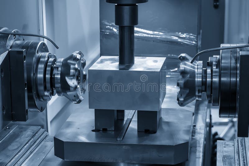 The Duplex CNC Milling Machine Cutting the Metal Parts in the Light ...