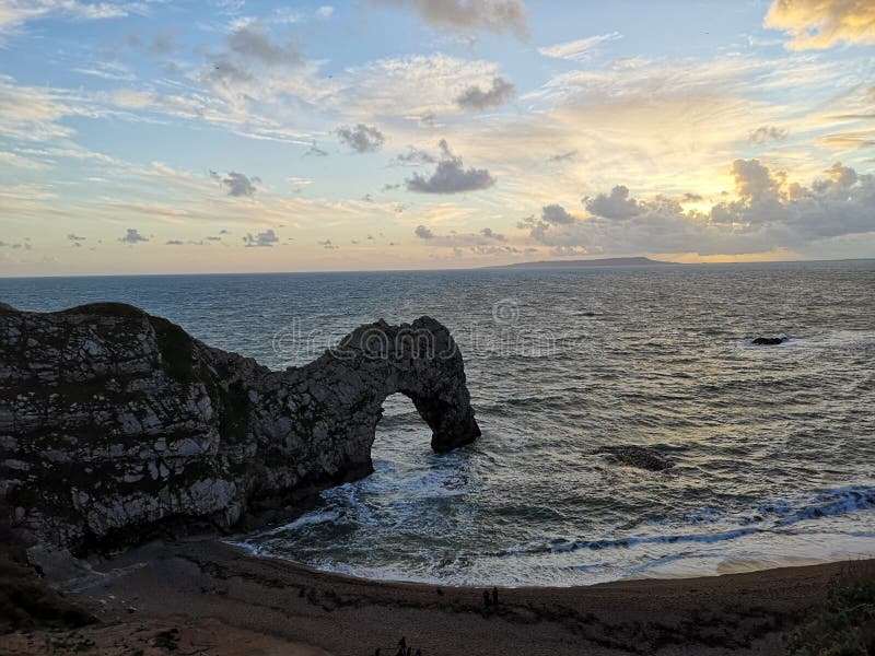 Durdle Door in the Evening from Top Cliff Stock Photo - Image of shore ...