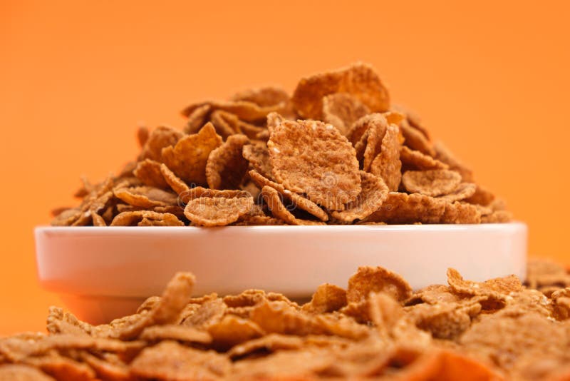 Durum Wheat Flakes - Quick Breakfast Cereal on a Plate on an Orange ...