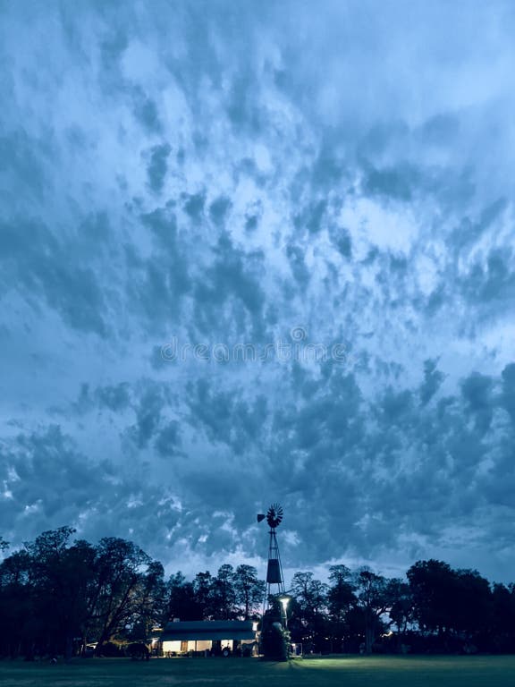 Dusk Falling Behind a Windmill Stock Photo - Image of africa, cloud ...