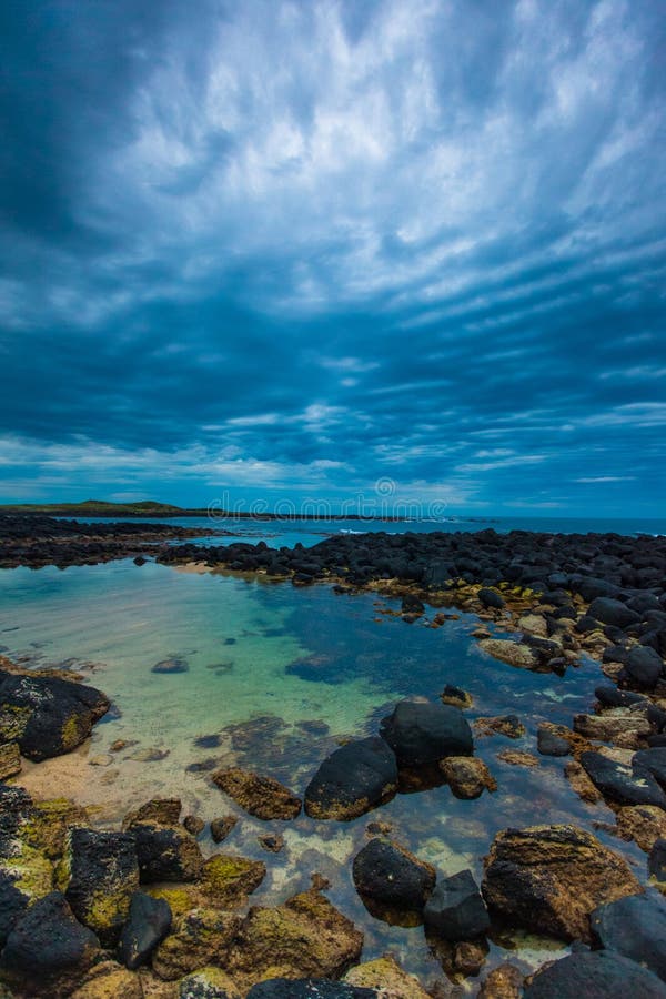 Dusk Over Ocean Volcanic Rock Pool on a Cloudy Sky Stock Photo - Image ...