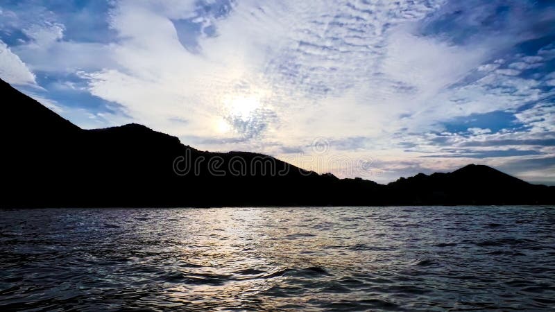 Dusky Mountains and Light Sunset Stock Photo - Image of dawn, calm ...