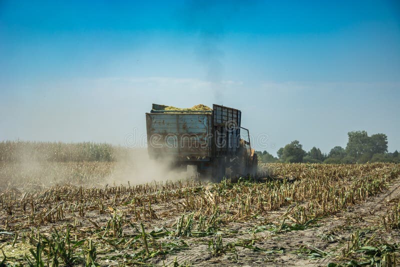 Dust Behind a Tractor with a Trailer in the Field Stock Photo - Image ...
